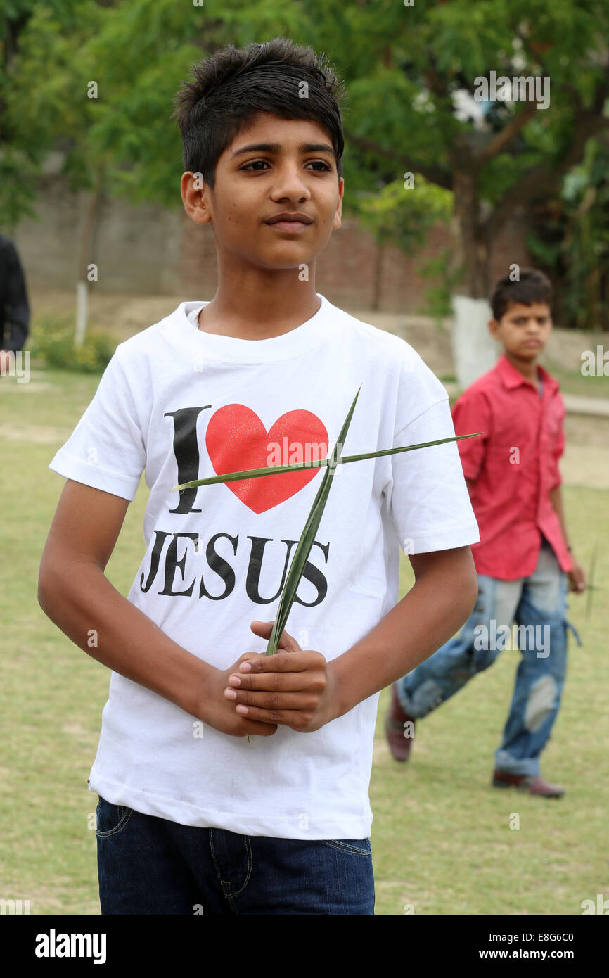 Catholic christian boy with palm leves forming a cross. Palm Sunday in ...
