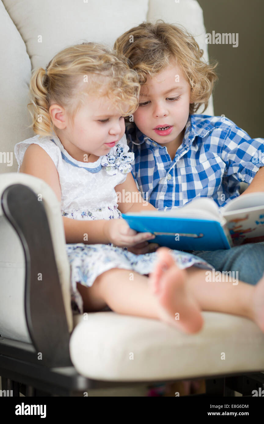Children sharing book hi-res stock photography and images - Alamy