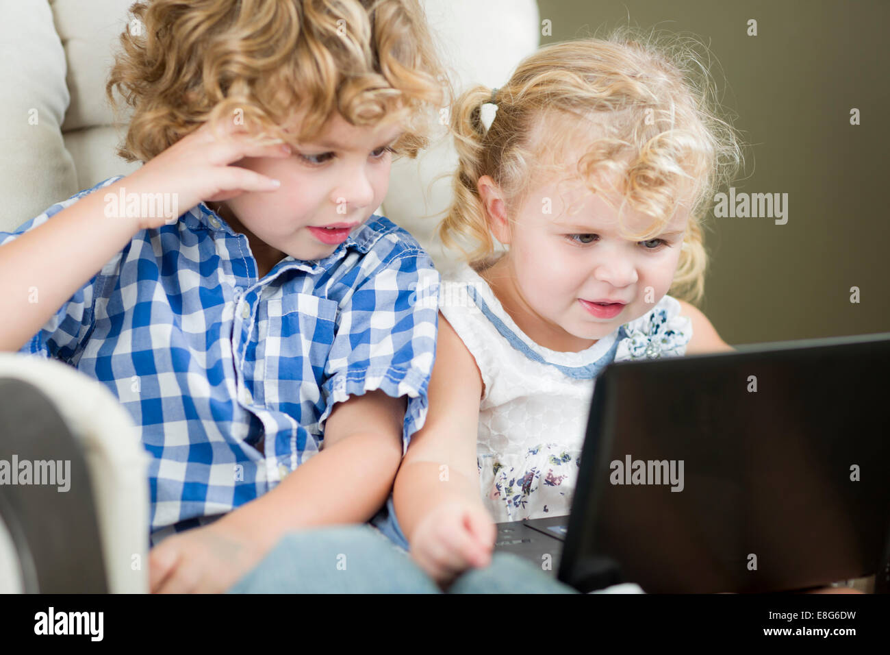Adorable Young Brother and Sister Using Their Computer Laptop Together ...