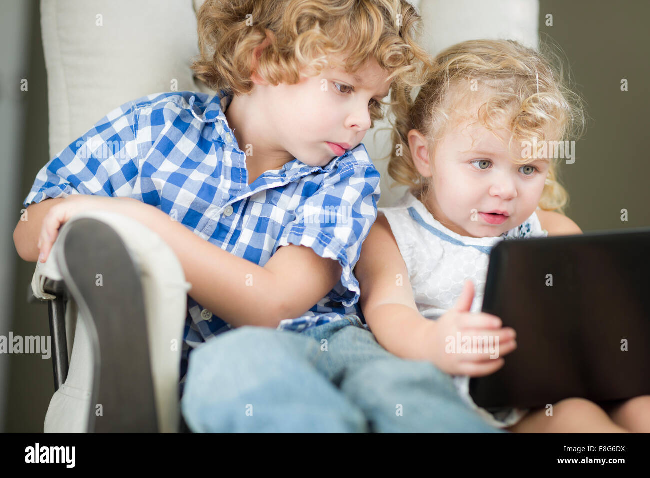 Adorable Young Brother and Sister Using Their Computer Laptop Together ...