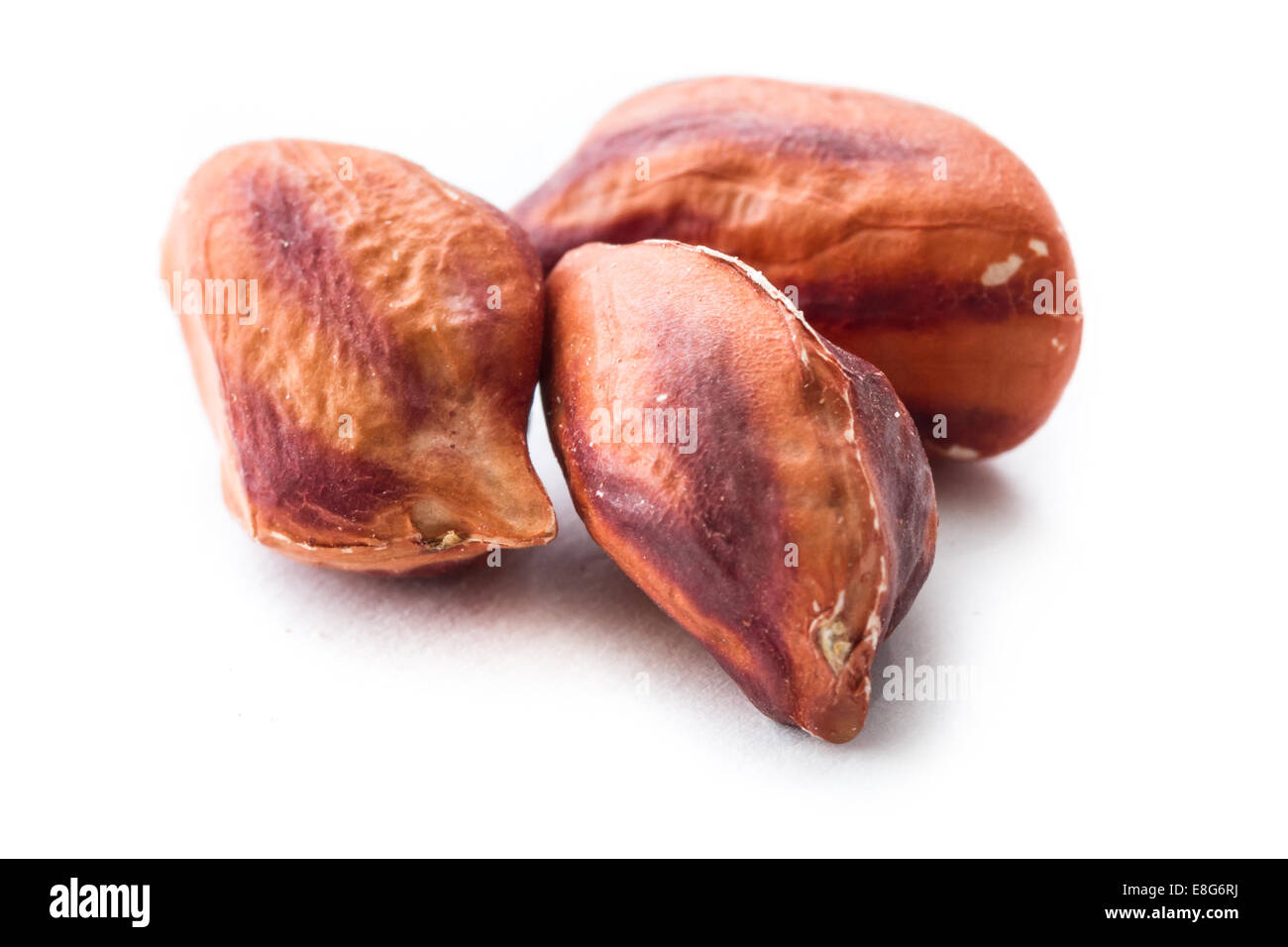 close up of organic raw jungle peanuts isolated on a white background ...