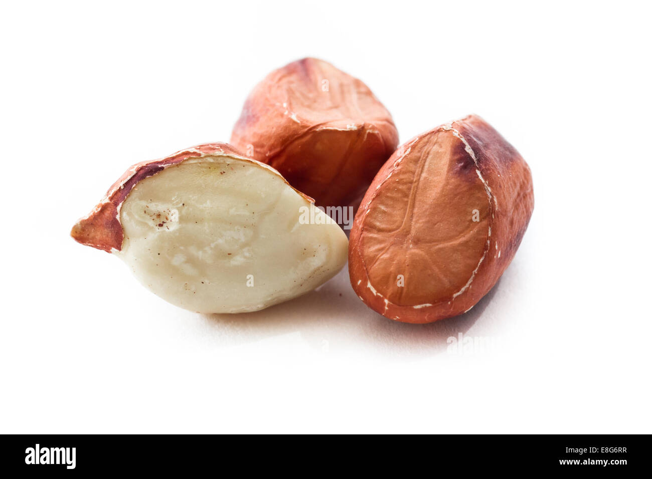 close up of organic raw jungle peanuts isolated on a white background ...