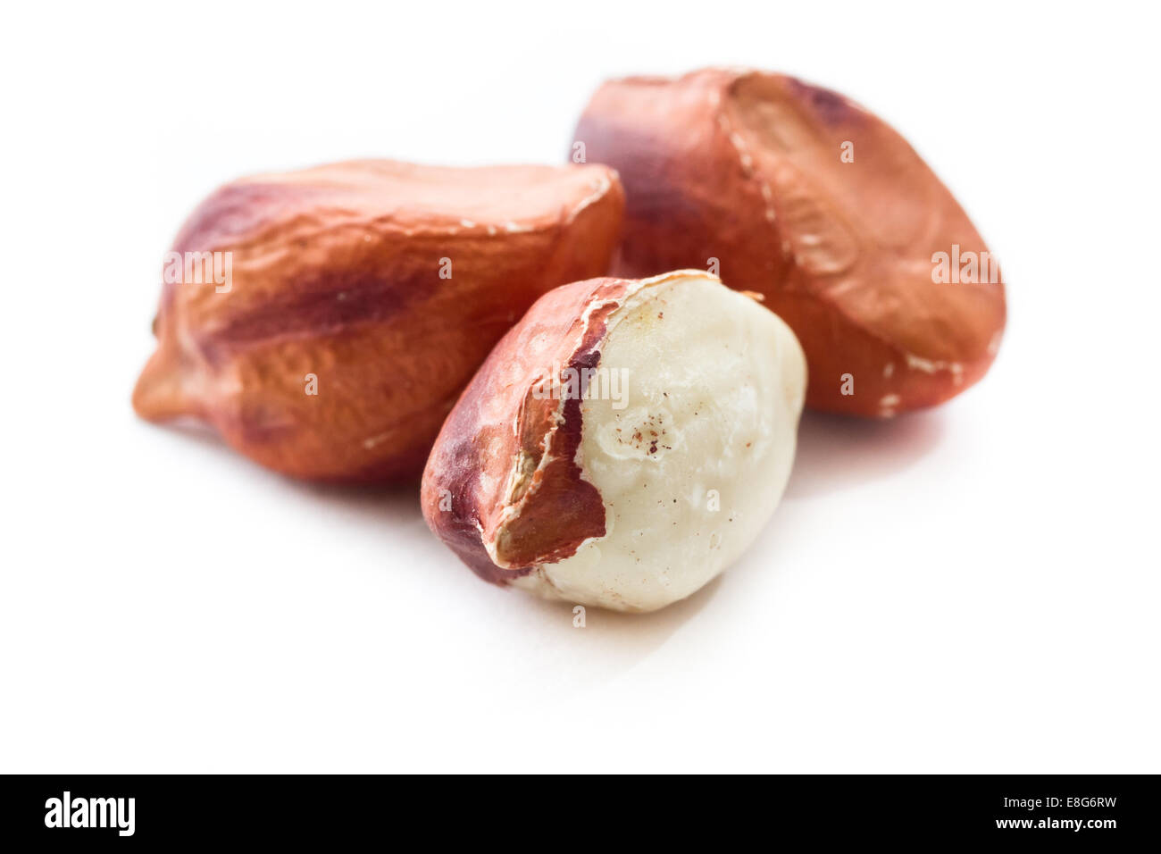 close up of organic raw jungle peanuts isolated on a white background ...