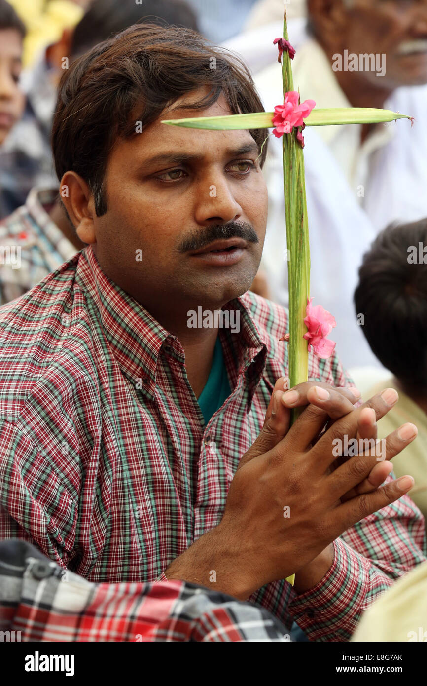Catholic christian man with palm leaves forming a cross. Palm Sunday ...