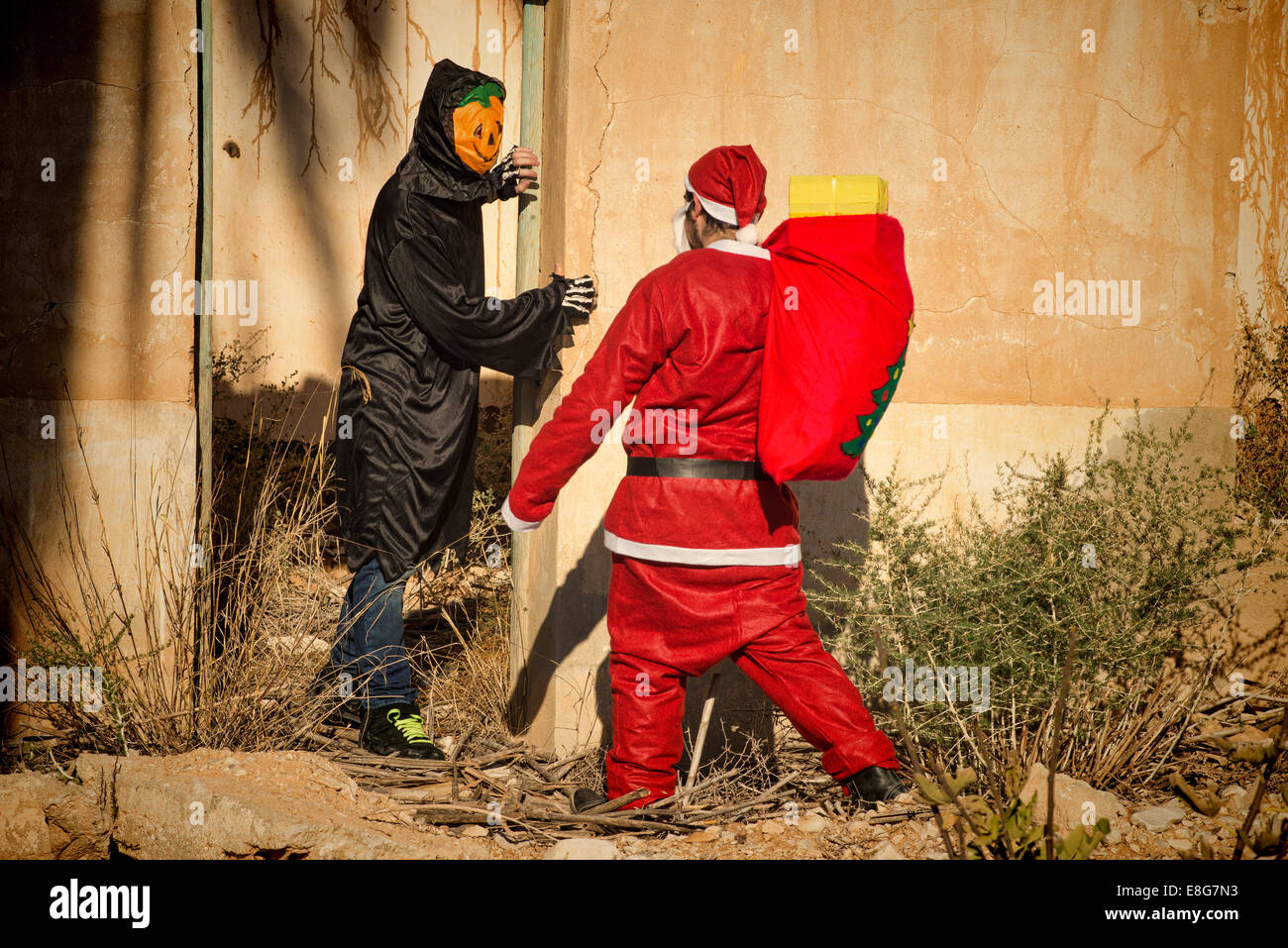 Santa in trouble, a holiday heroes confrontation Stock Photo - Alamy