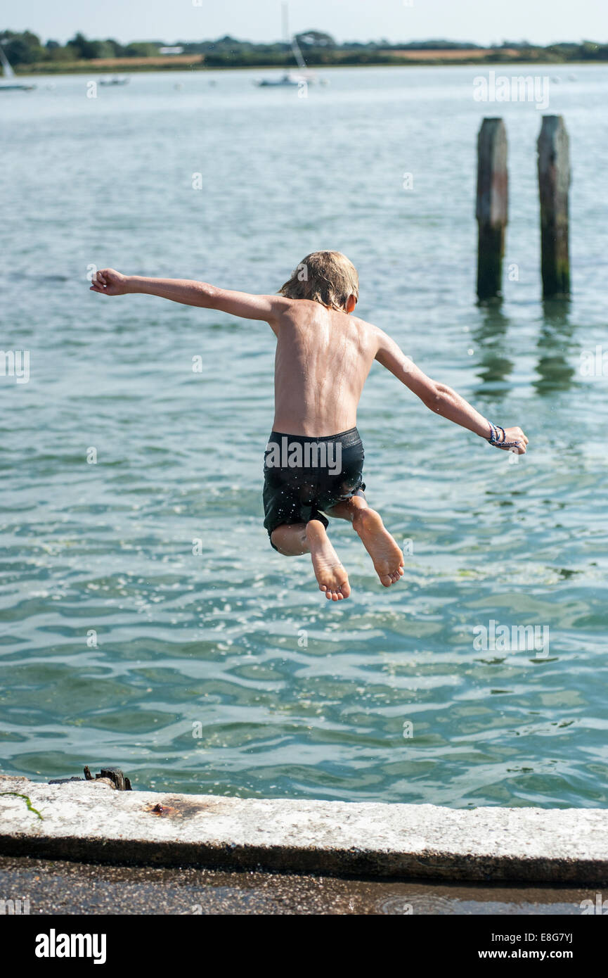 Boy dive jetty hi-res stock photography and images - Alamy