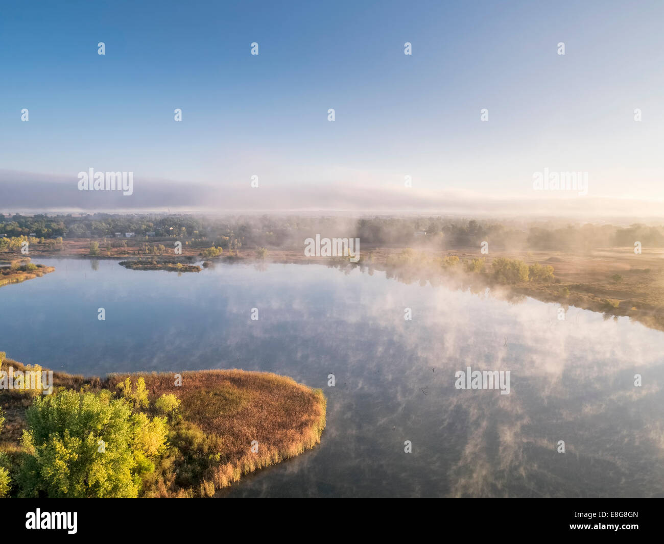 aerial view of a morning fog over lake, early fall scenery, Riverbend ...