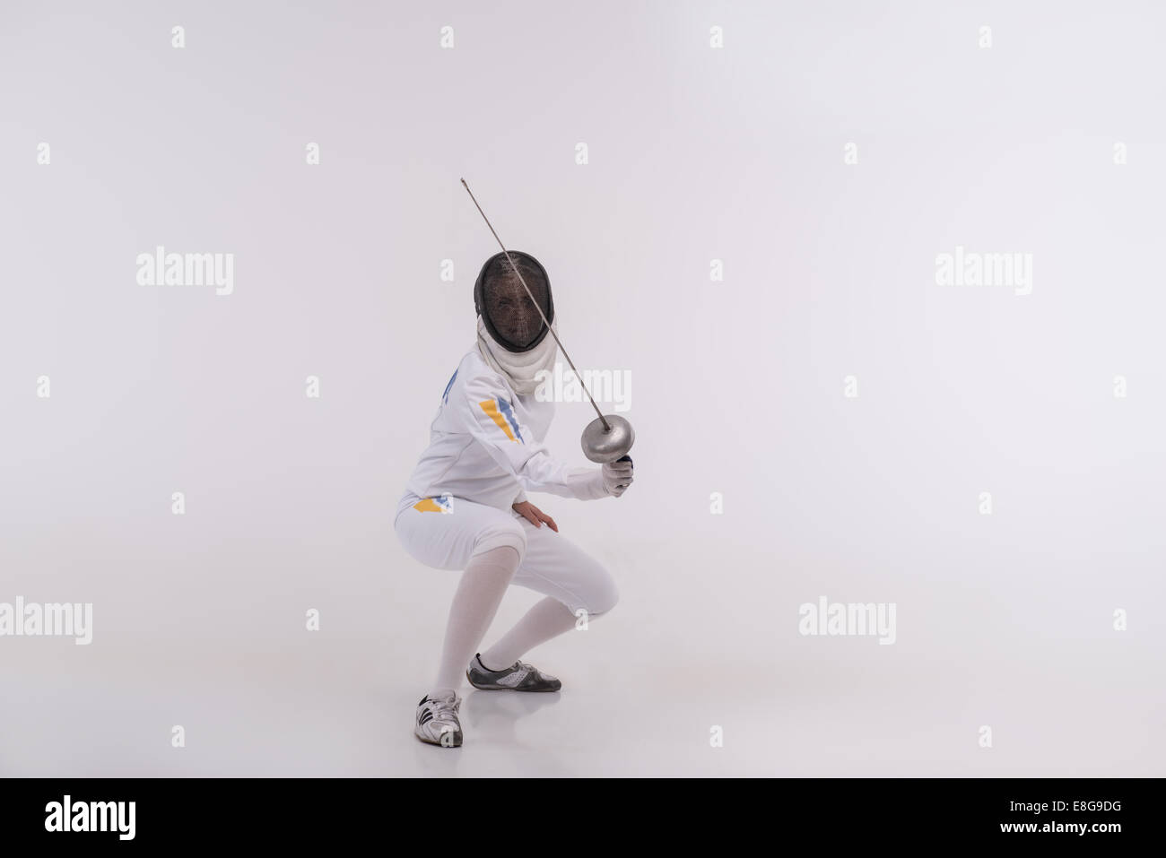 Young woman engaging in fencing Stock Photo - Alamy