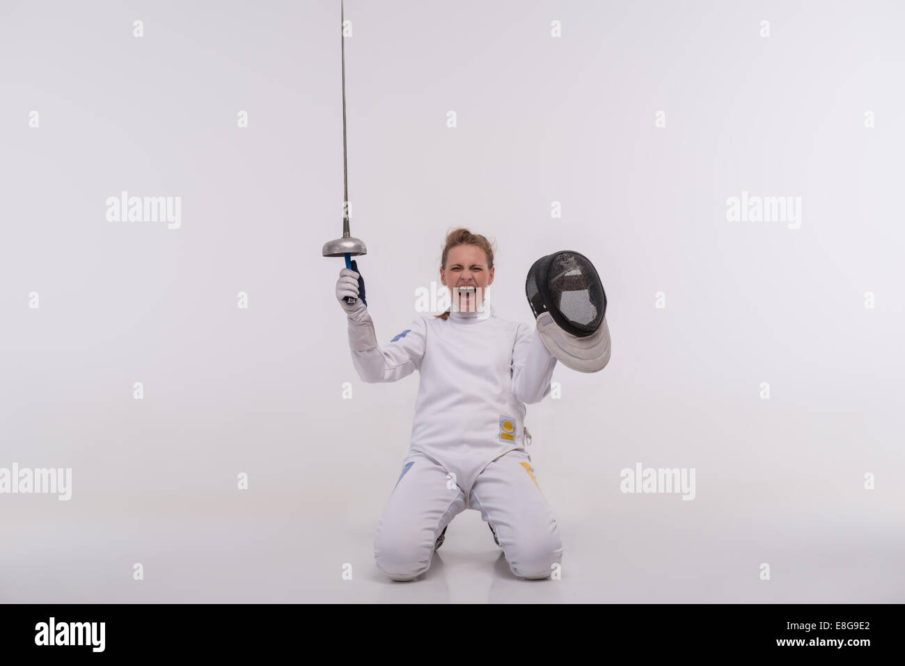 Young woman engaging in fencing Stock Photo - Alamy