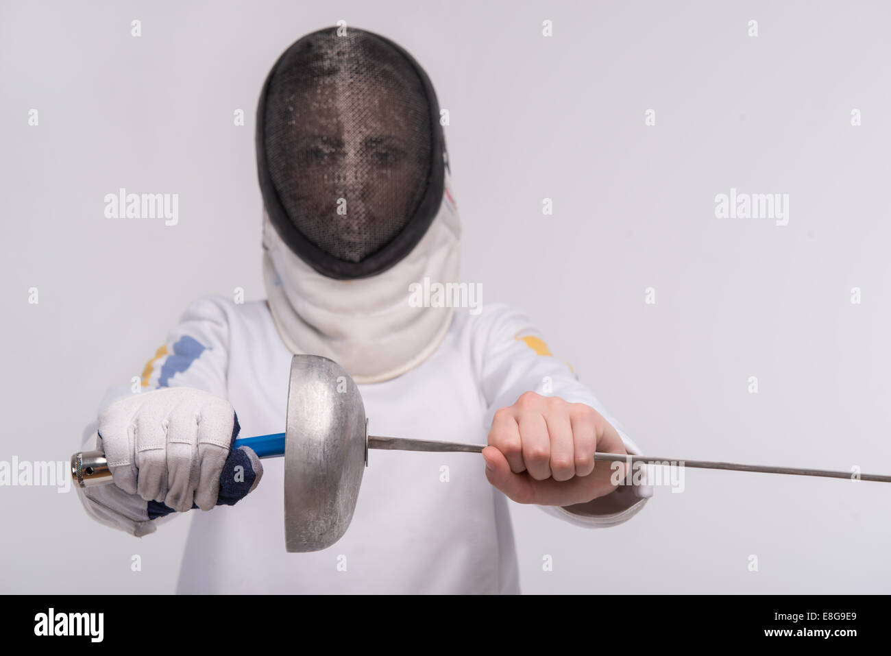 Young woman engaging in fencing Stock Photo - Alamy