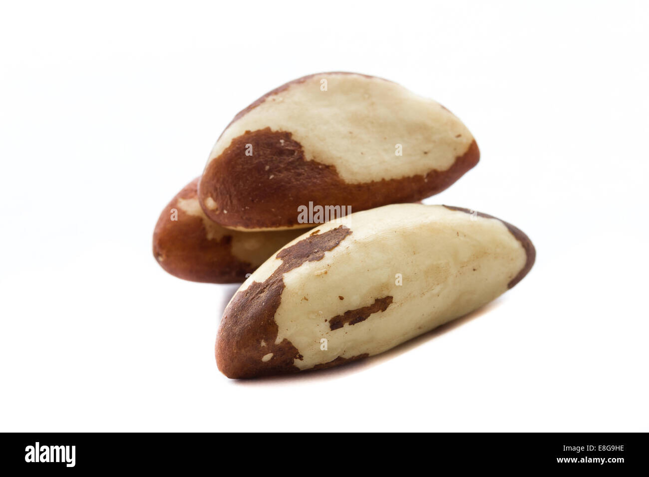 macro of three raw brazil nuts isolated on a white background Stock ...