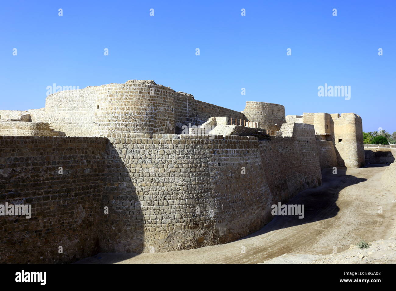 Fortified walls and moat of the Bahrain Fort, Kingdom of Bahrain Stock ...