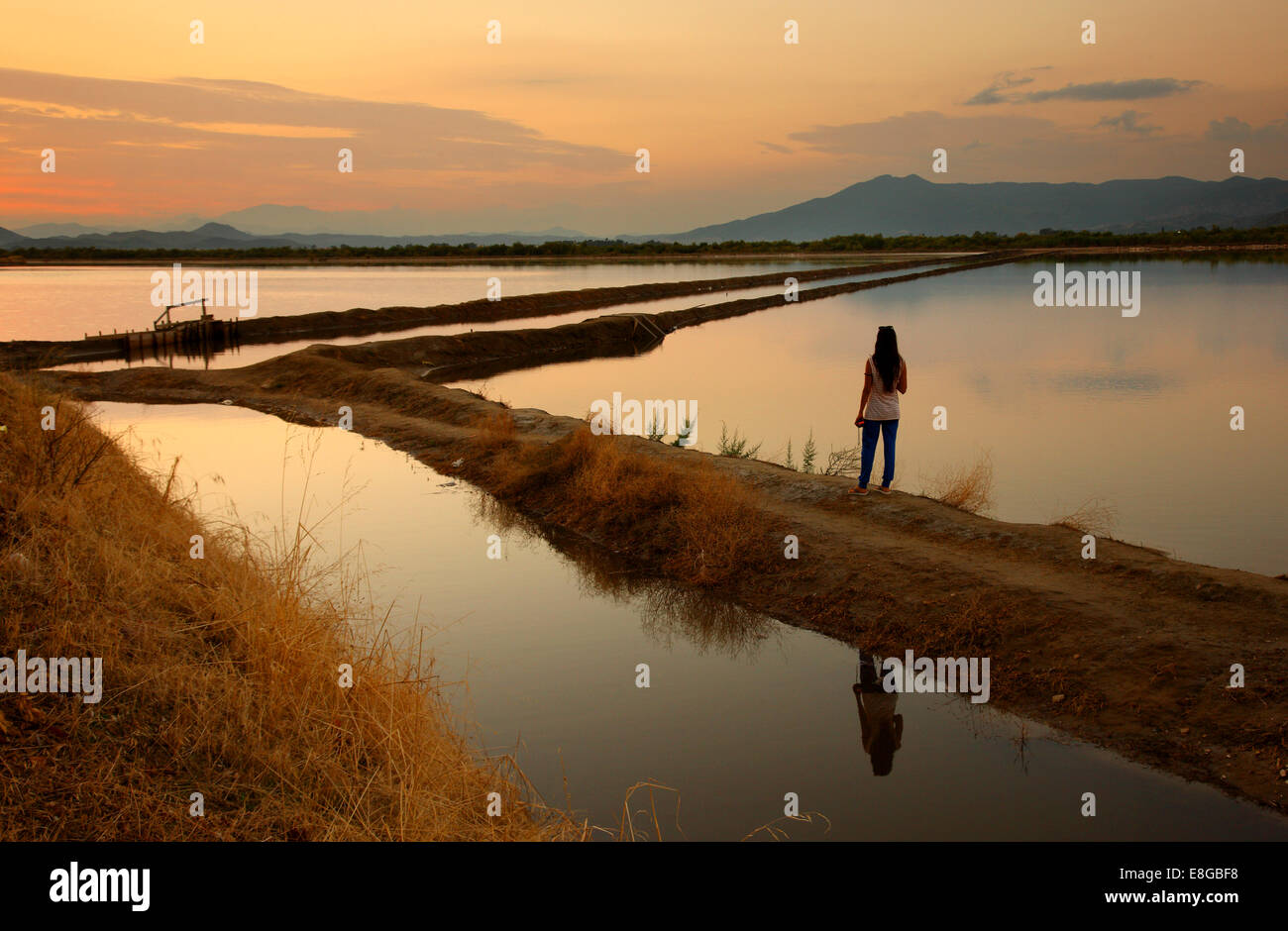 Sunset at the Canal of Foinikia (popular for mudbaths), lagoon of ...