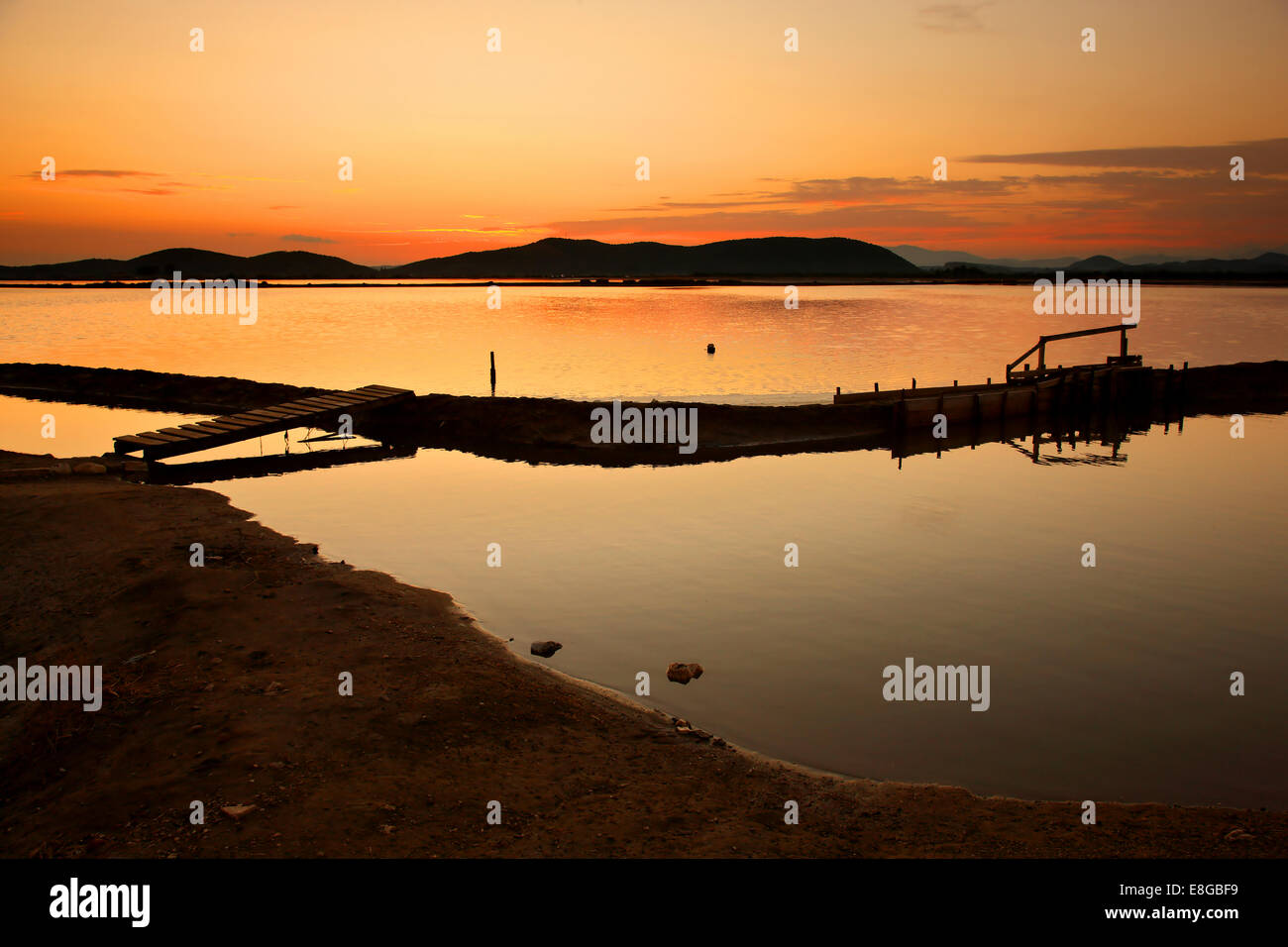 Sunset at the Canal of Foinikia (popular for mudbaths), lagoon of ...