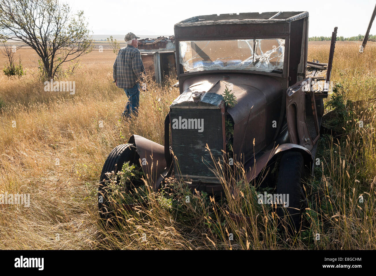 Henry Armstrong walks past a 1929 Ford Model A, he says was still in ...