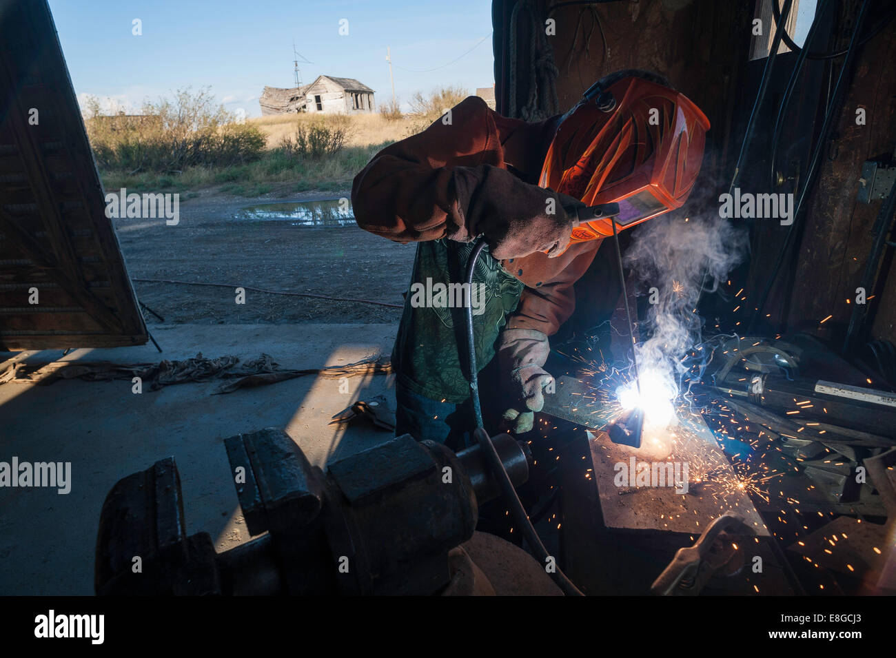 Alan Armstrong, 24, welds together some seed drills in northern Montana ...