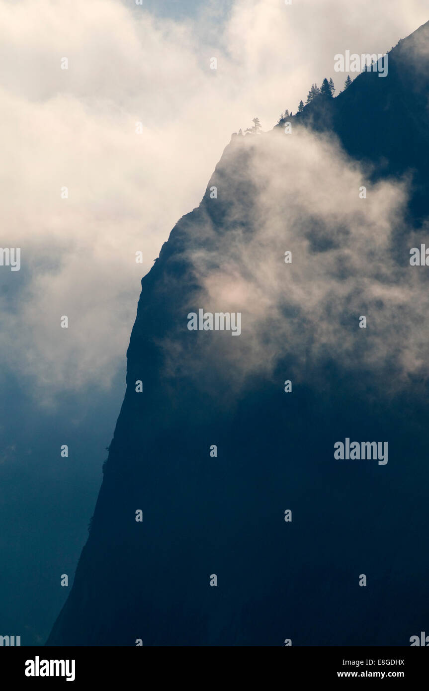 Cliff in clouds from Yosemite Falls Trail, Yosemite National Park ...
