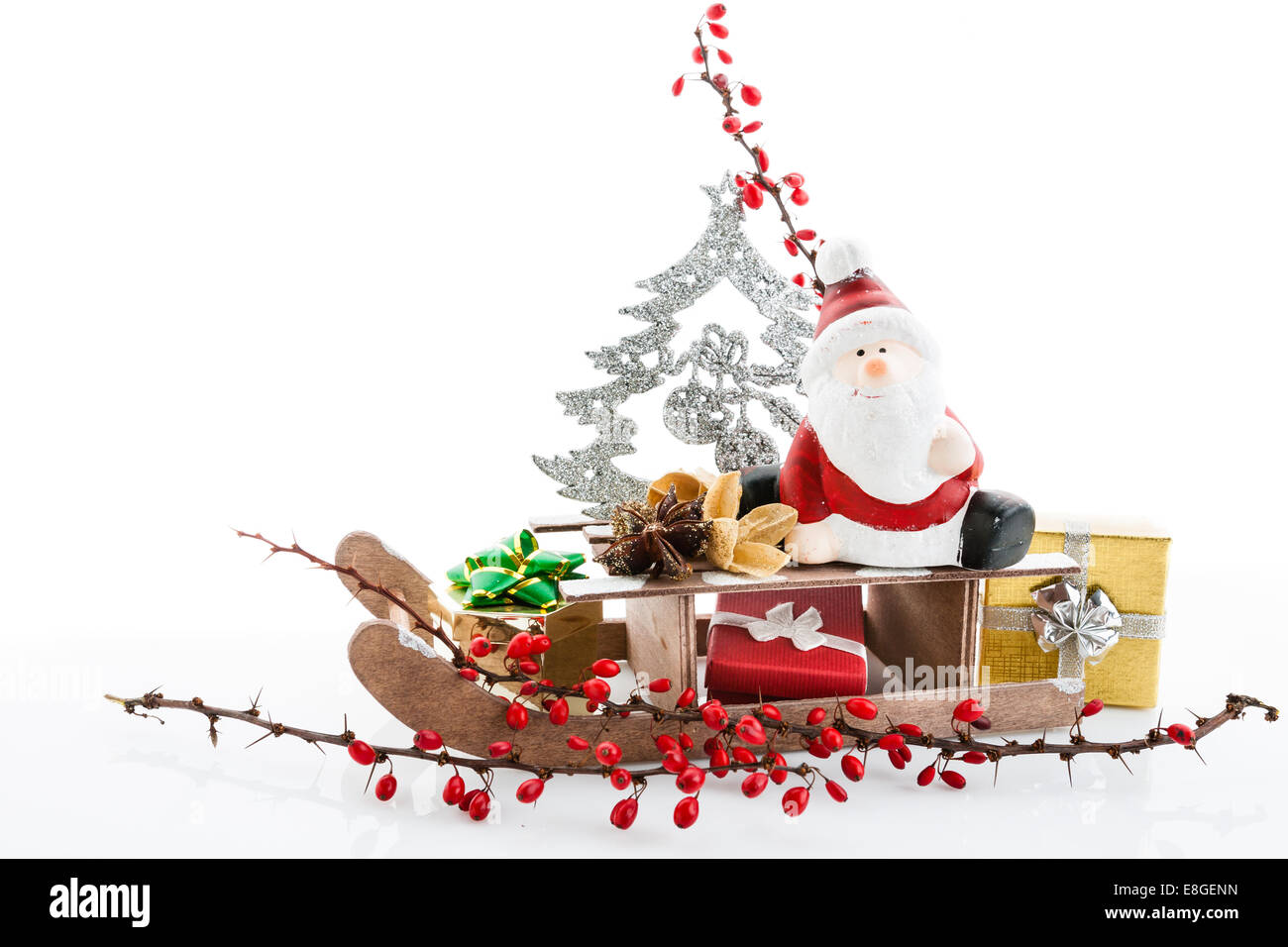 Santa Claus sitting on wooden sledge sledge holding gift and present ...