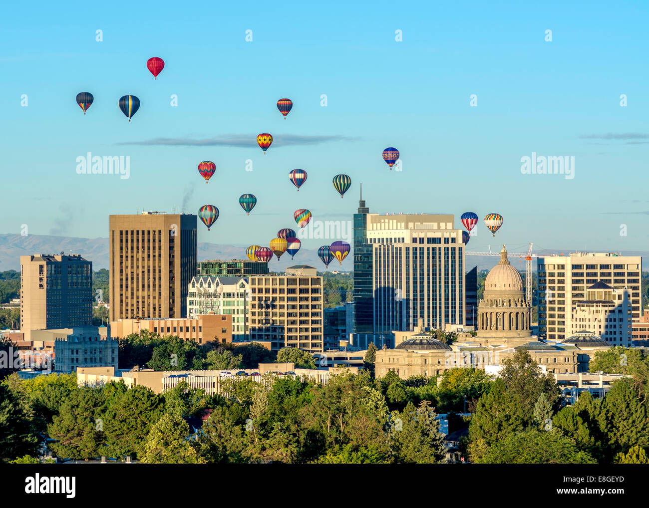 Balloons liftoff over the city of Boise Idaho Stock Photo - Alamy