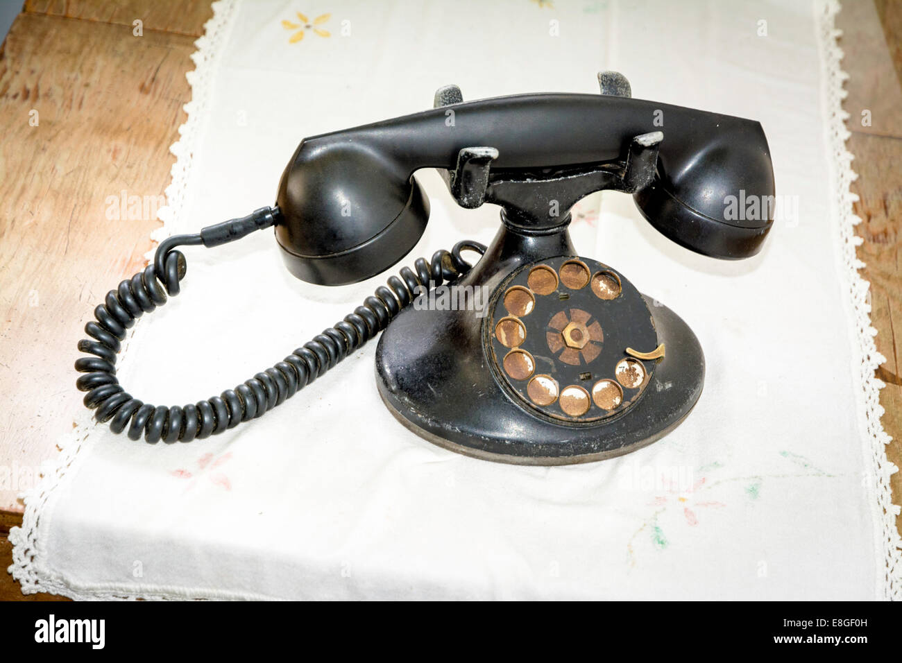 Old fashion phone on a table in a home Stock Photo - Alamy
