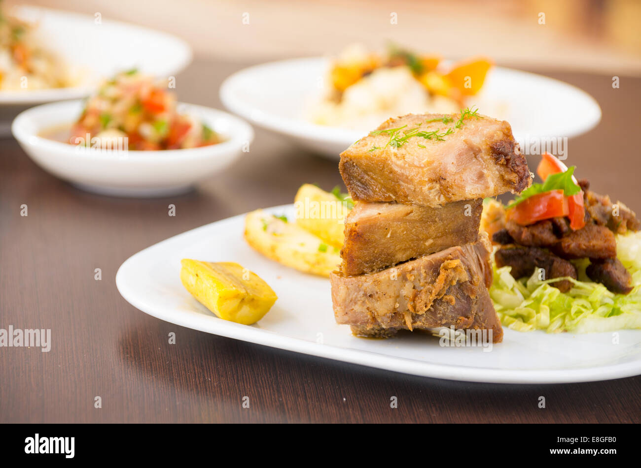 fritada fried pork traditional ecuadorian food Stock Photo - Alamy