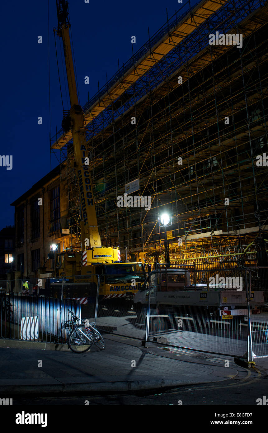 Work progresses through the night on repairs to the Mackintosh Building ...