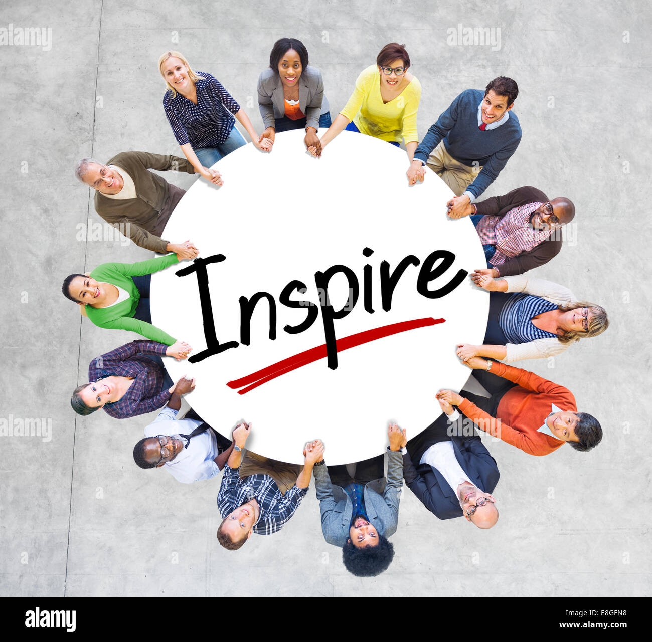 Group of People Holding Hands Around Letter Inspire Stock Photo - Alamy