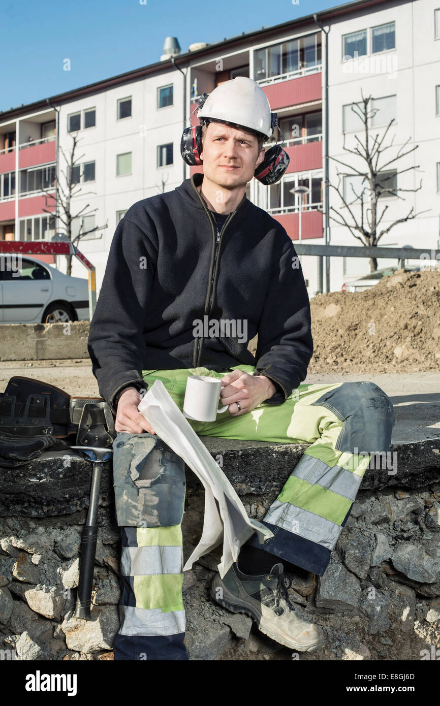 Construction drinking coffee construction site hi-res stock photography ...