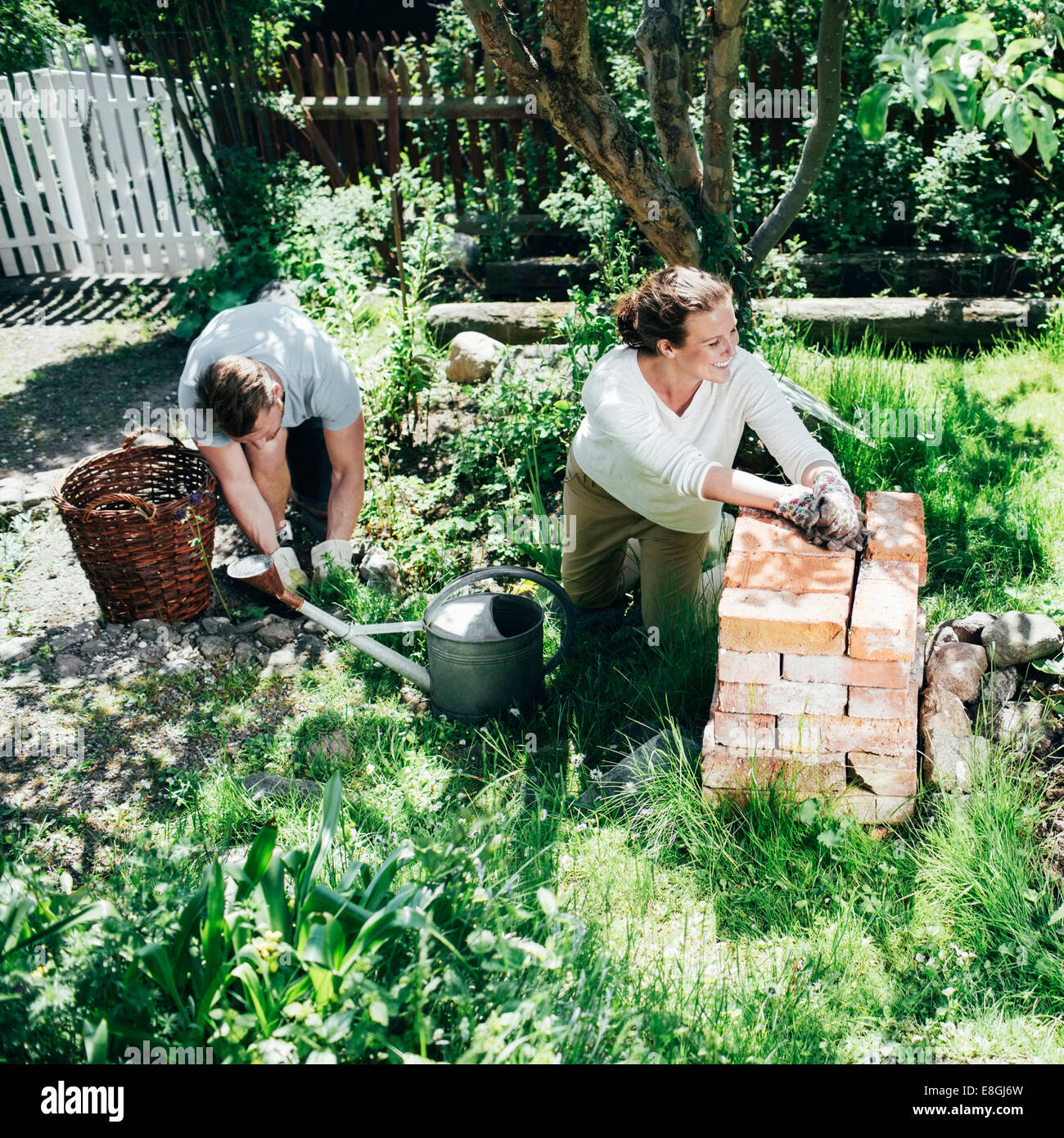 Couple gardening at yard Stock Photo - Alamy