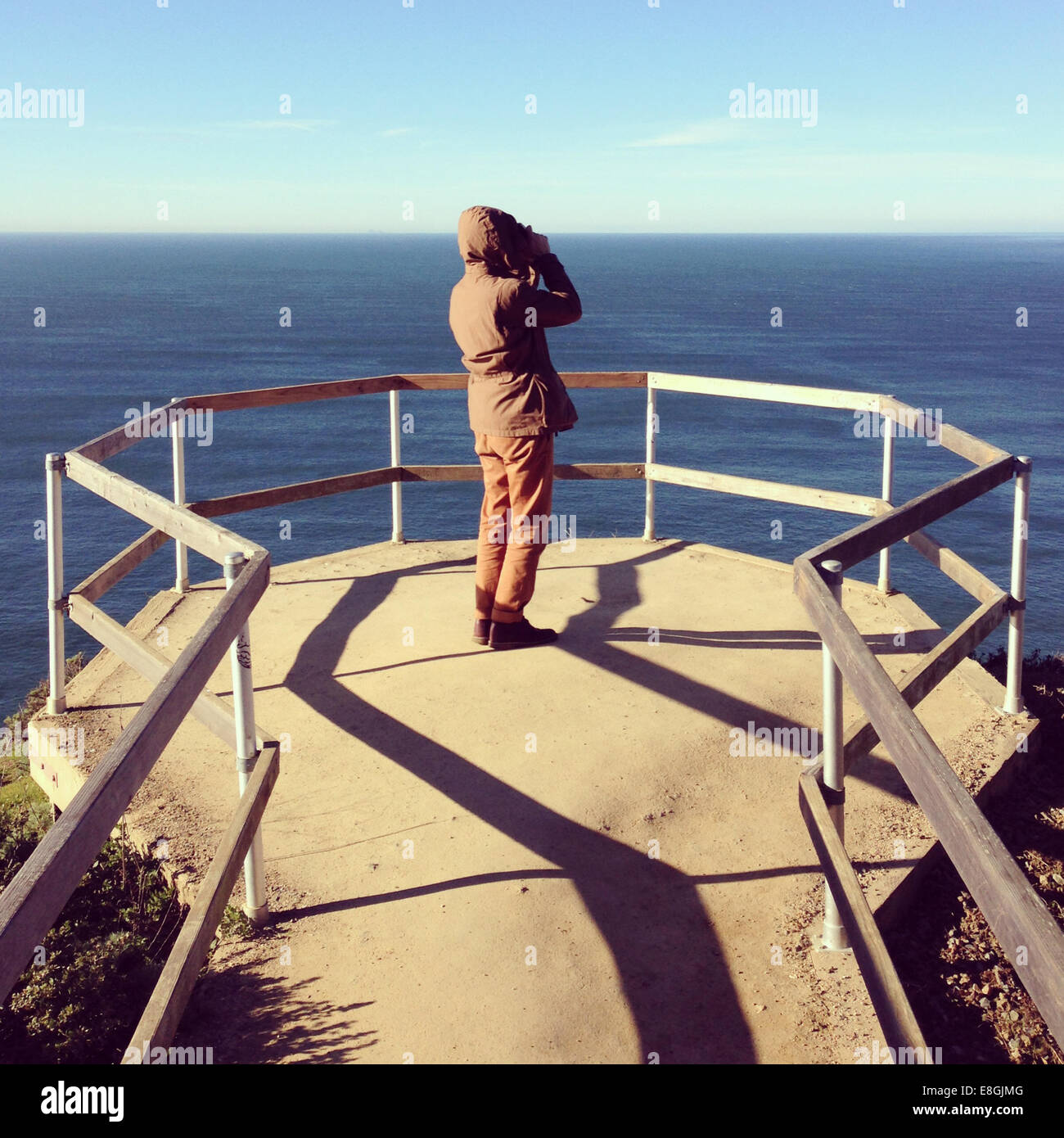 Man looking out over ocean at the muir overlook hi-res stock ...