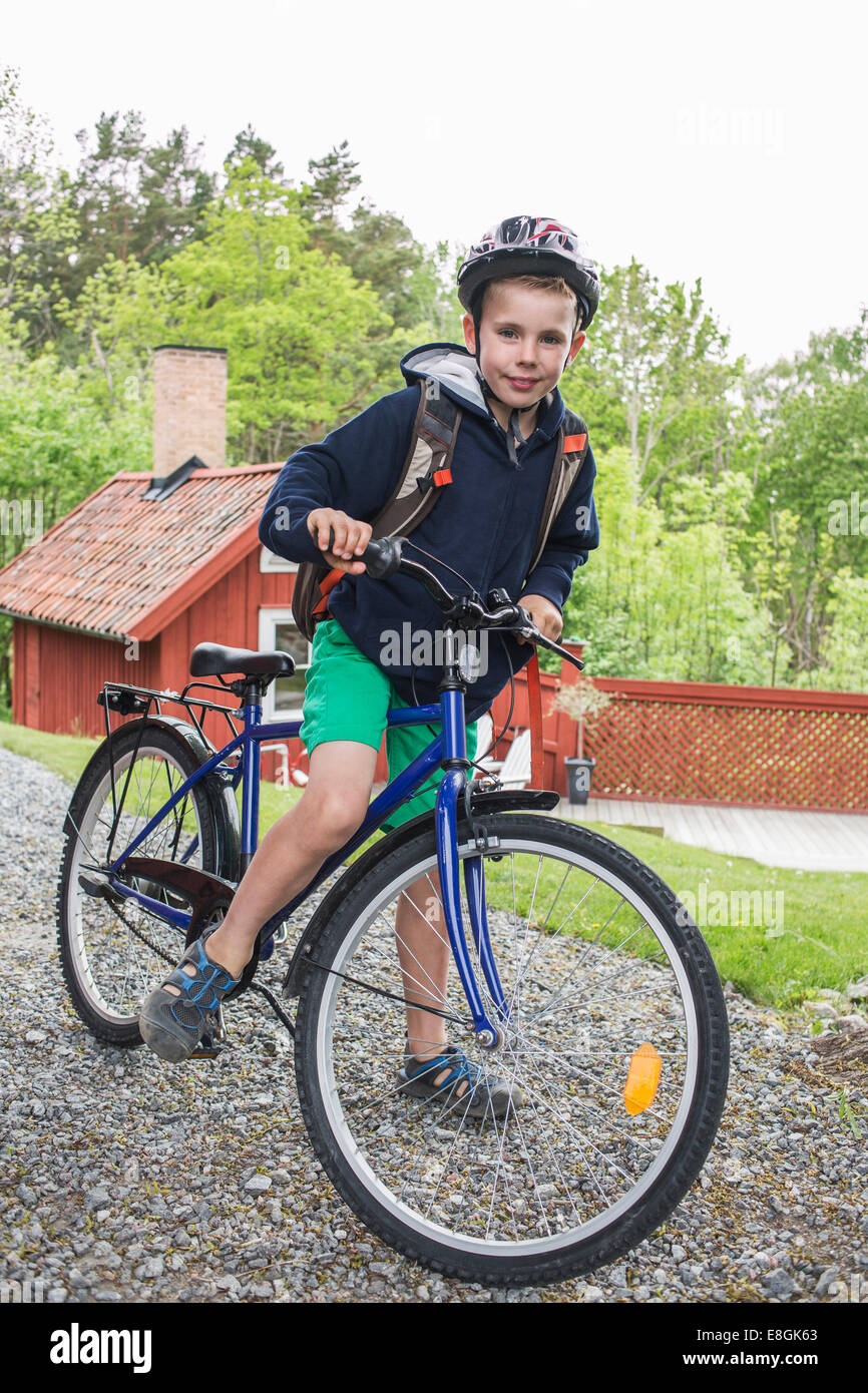 Portrait of boy on bicycle Stock Photo - Alamy