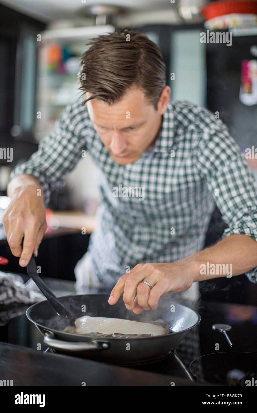 Cooking fish hi-res stock photography and images - Alamy