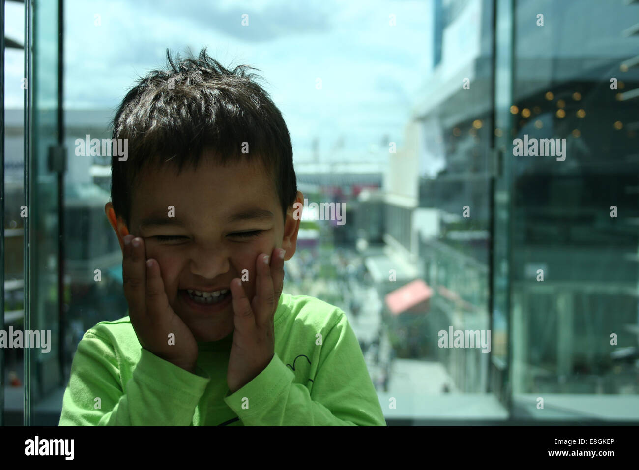Portrait of a boy laughing Stock Photo - Alamy