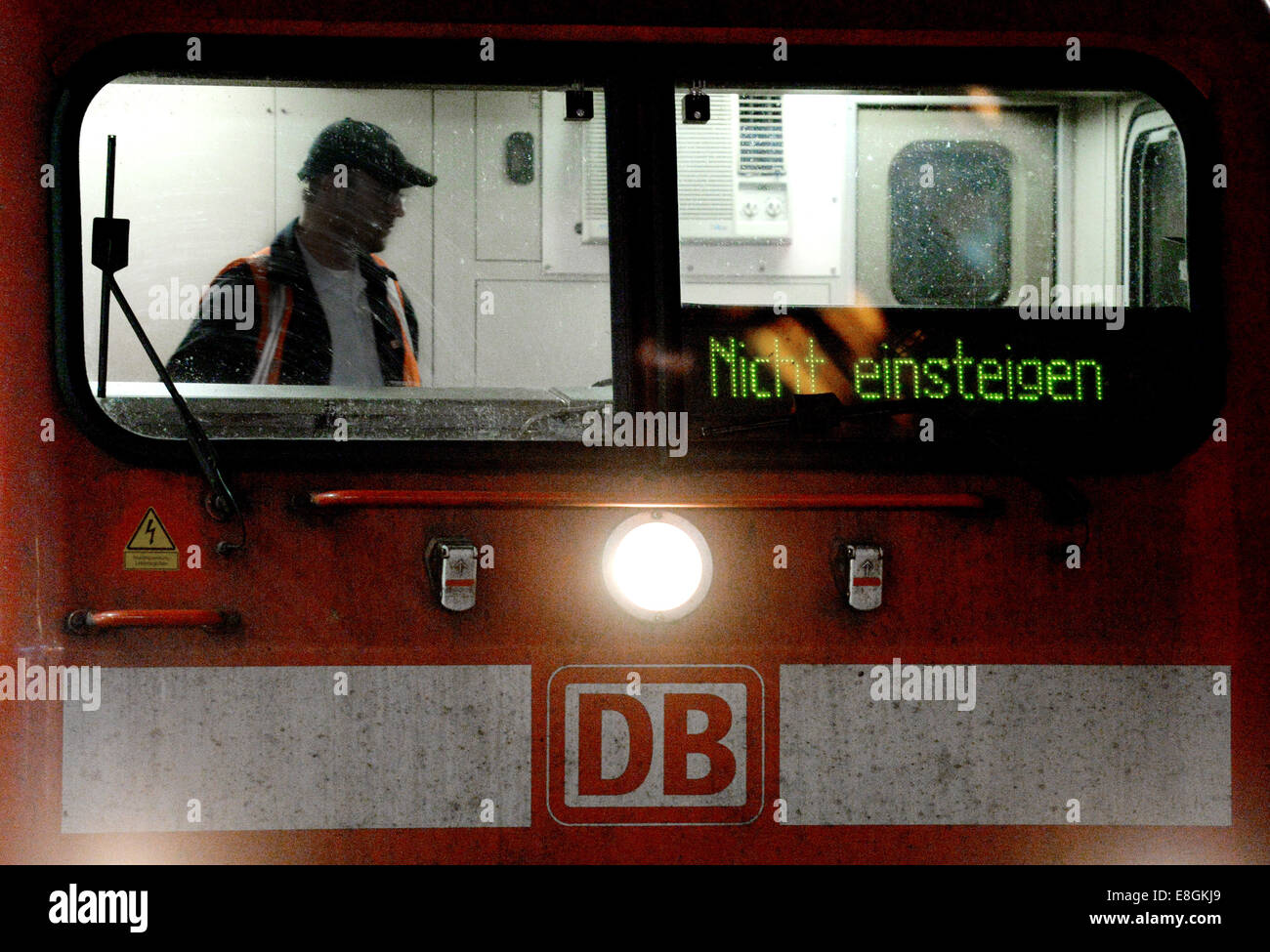 An Engine-driver in his train at the central train station in Hamburg ...