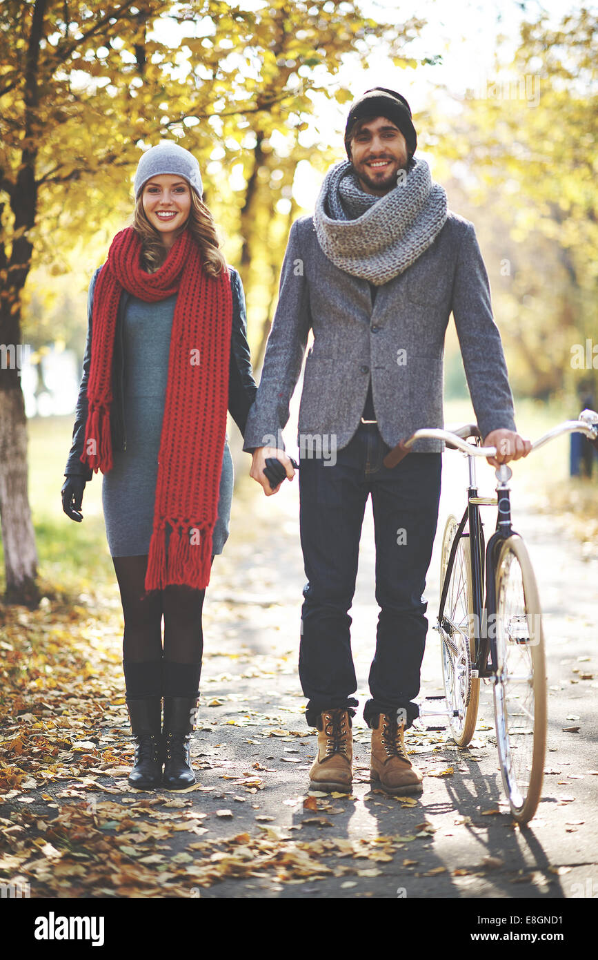 Portrait of young couple walking in autumn Stock Photo - Alamy