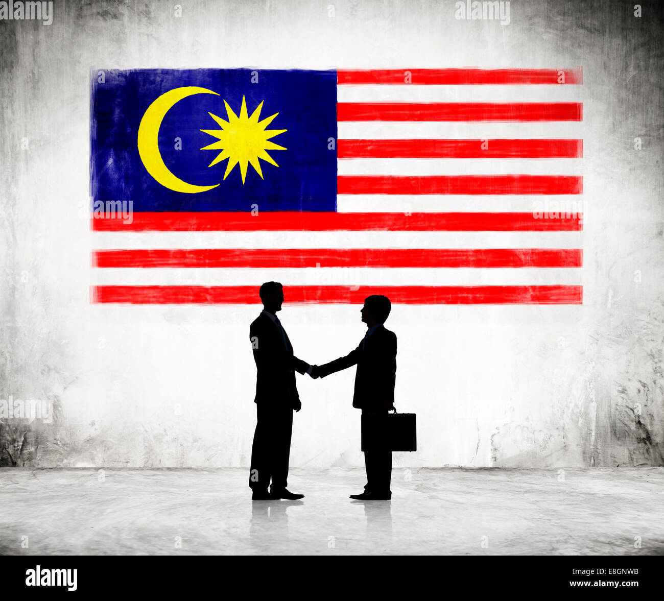 Two Businessmen Shaking Hands With Malaysian Flag As A Background Stock ...