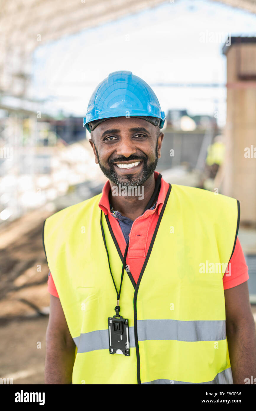 Portrait of happy construction worker at site Stock Photo - Alamy