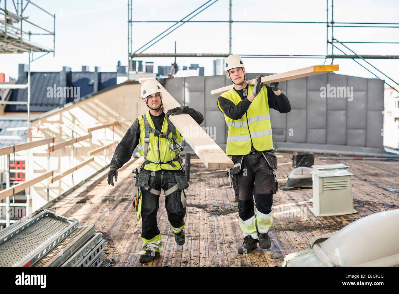 Man carrying wood planks hi-res stock photography and images - Alamy