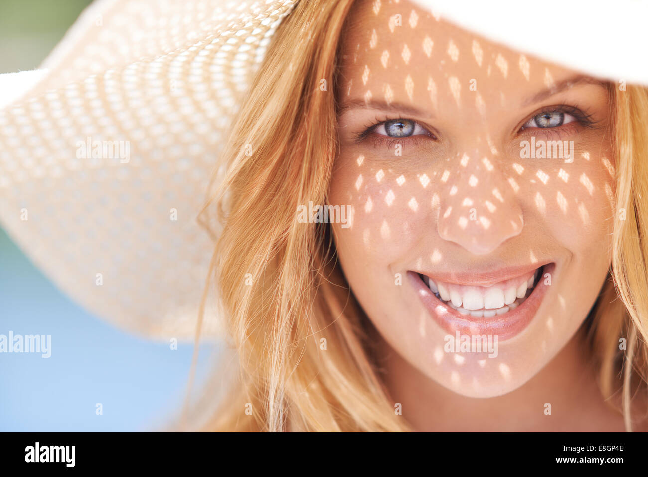 Close-up of smiling female face Stock Photo - Alamy
