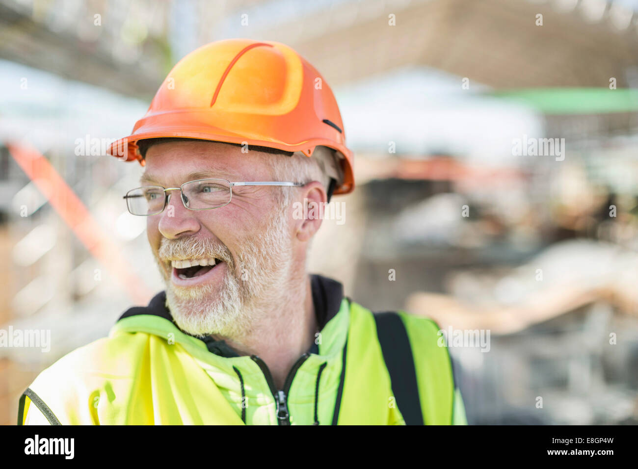 Happy construction worker at site Stock Photo - Alamy
