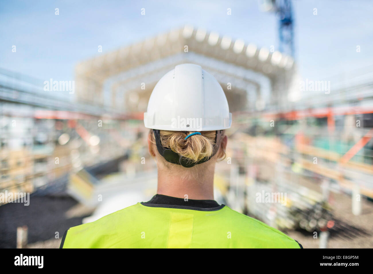 Rear view of male construction worker at site Stock Photo - Alamy