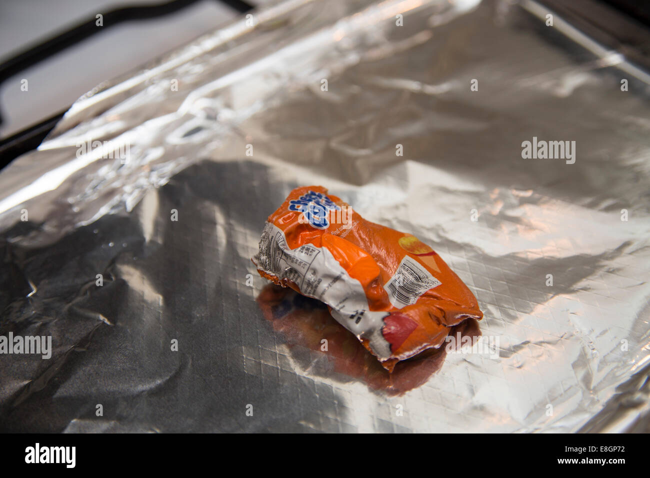 Collecting shrunken crisp packets hi-res stock photography and images ...