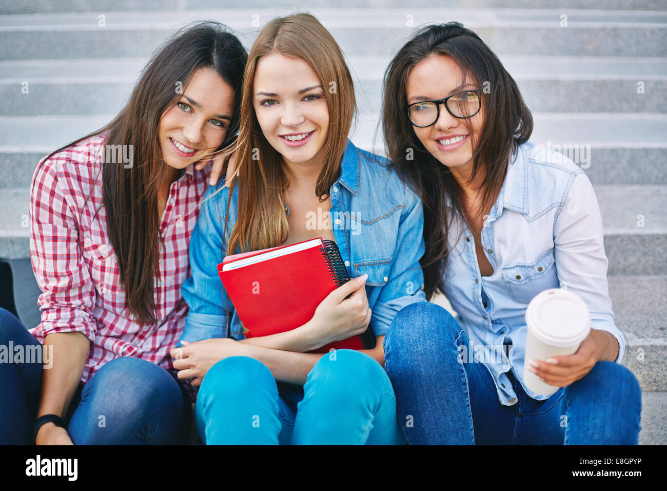 Portrait of three lovely female students Stock Photo - Alamy