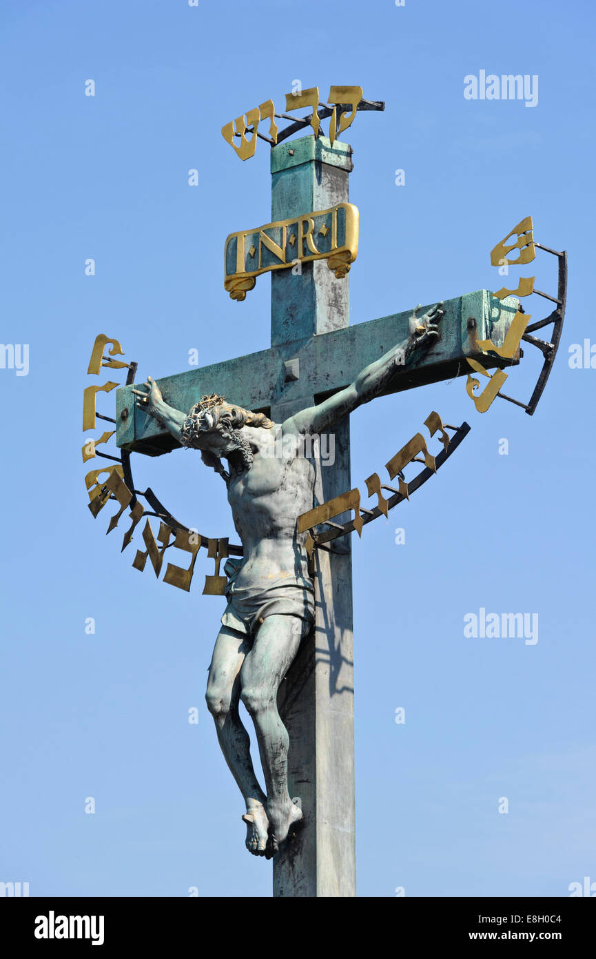 A statue of Jesus Christ on the cross on Charles bridge in Prague ...