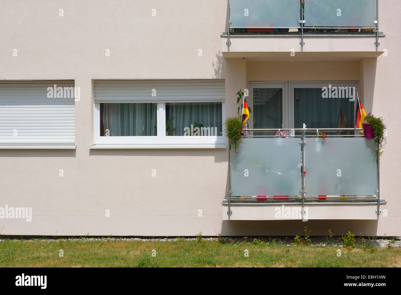 Germany, Bavaria, balcony with two flowerpots and two little German ...
