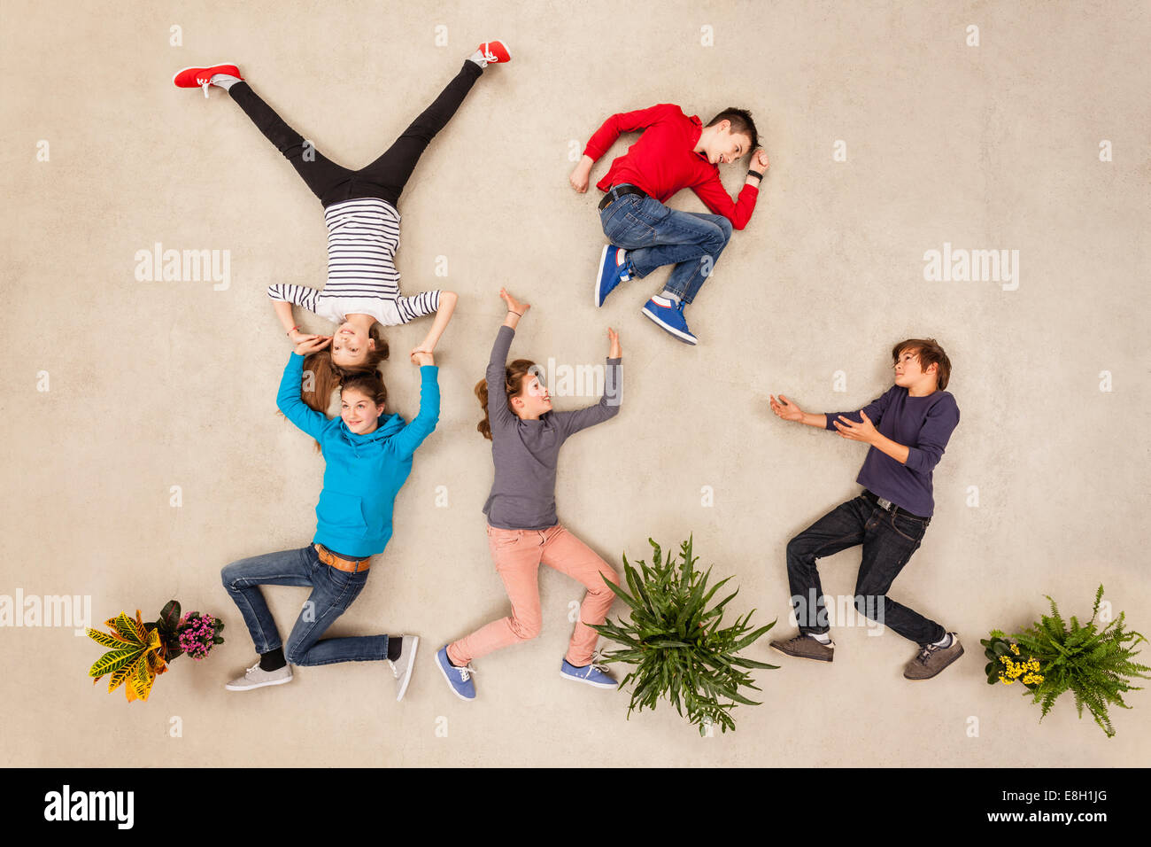 Children messing around in park Stock Photo - Alamy