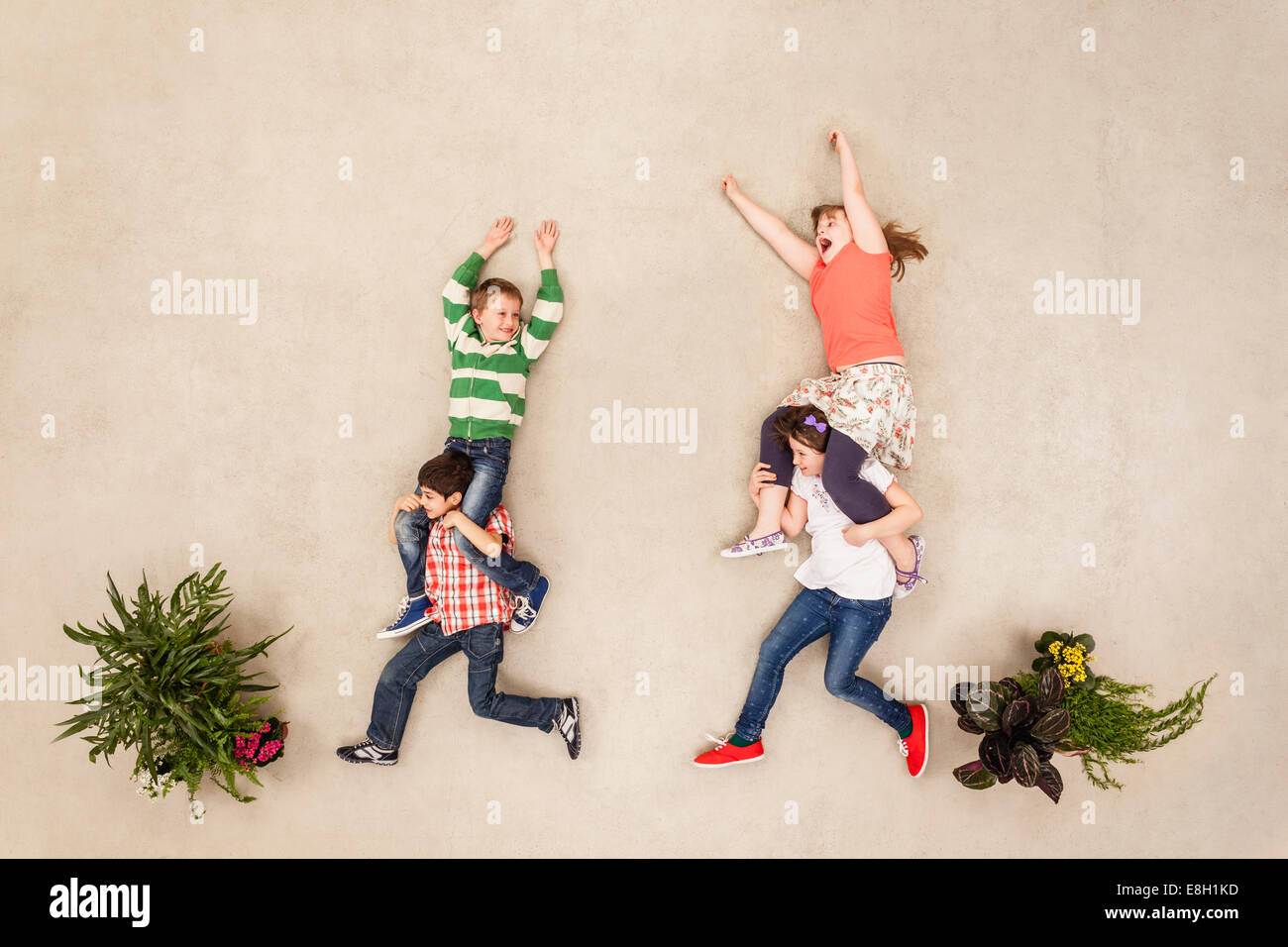 Children messing around in park Stock Photo - Alamy