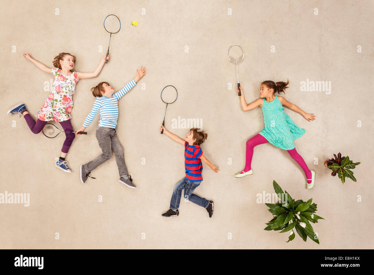 Children playing badminton in park Stock Photo - Alamy