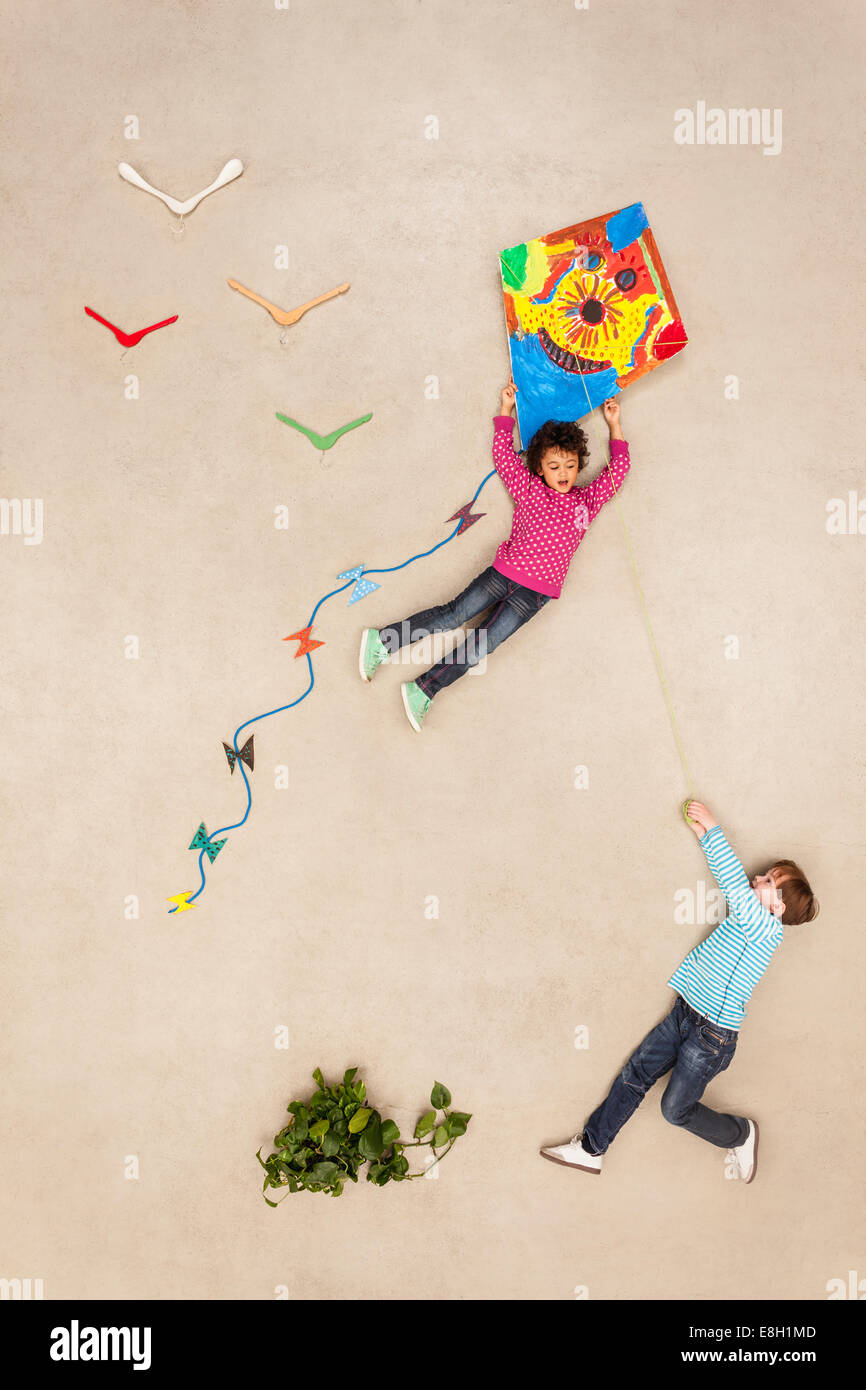Boys flying kite Stock Photo - Alamy