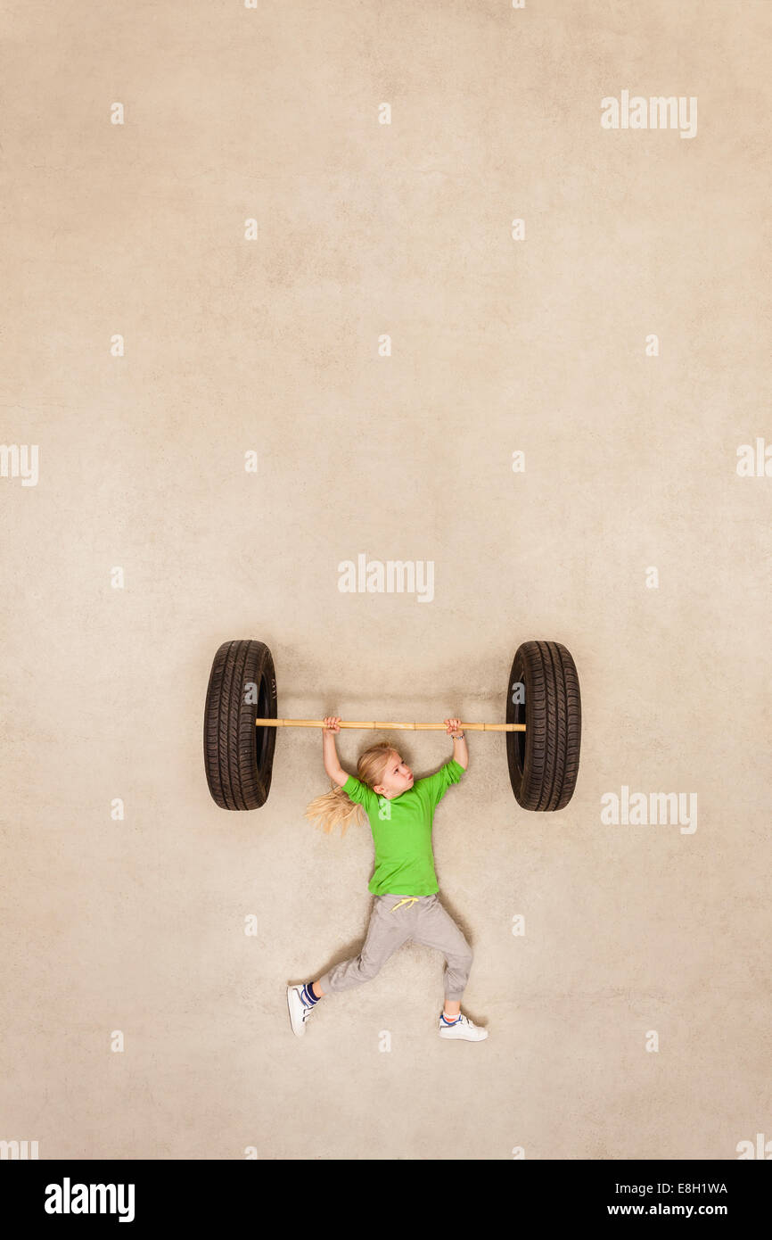 Boy lifting weights Stock Photo - Alamy